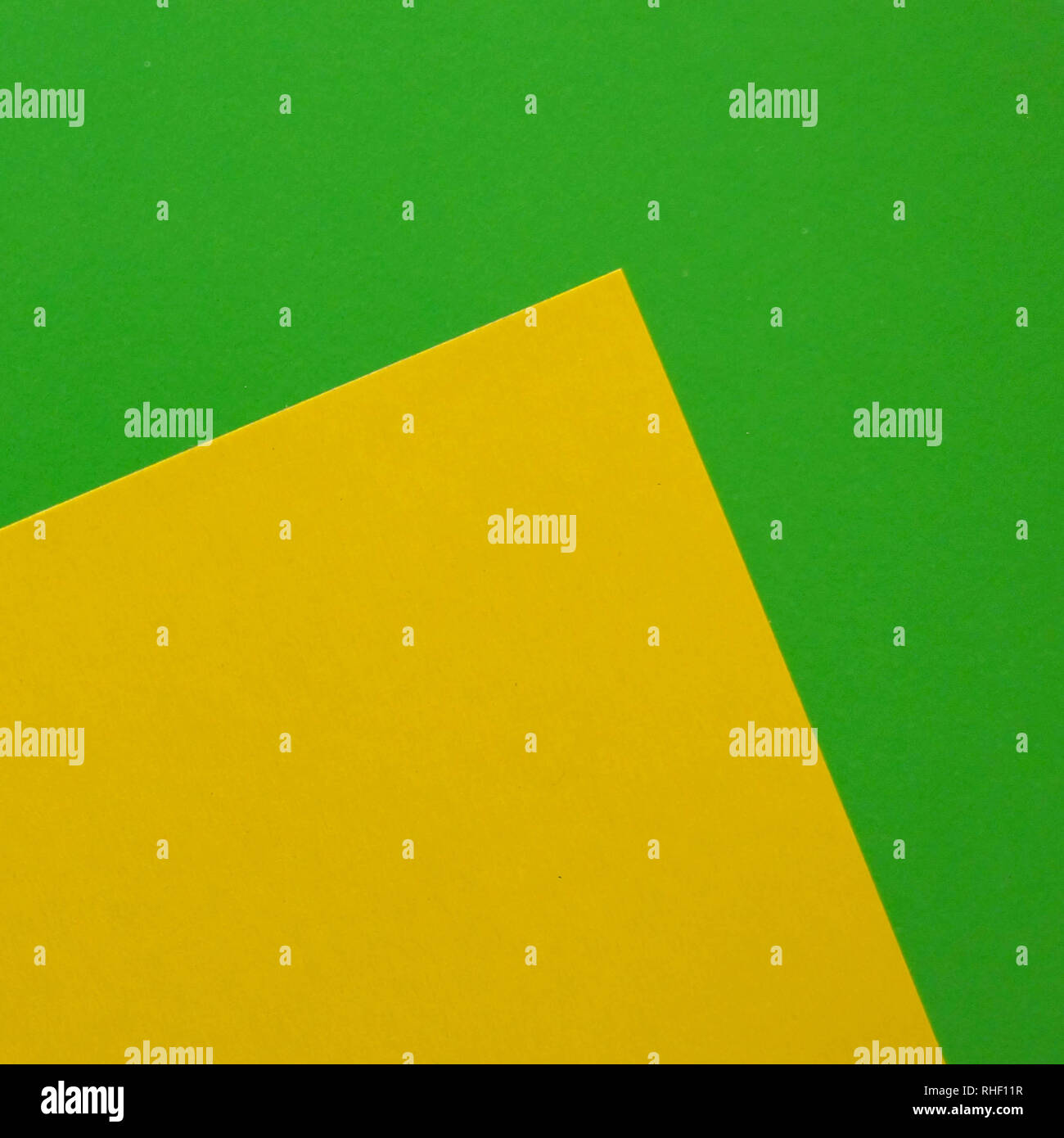 Abstract flat lay background with color paper sheets. Yellow and green ...