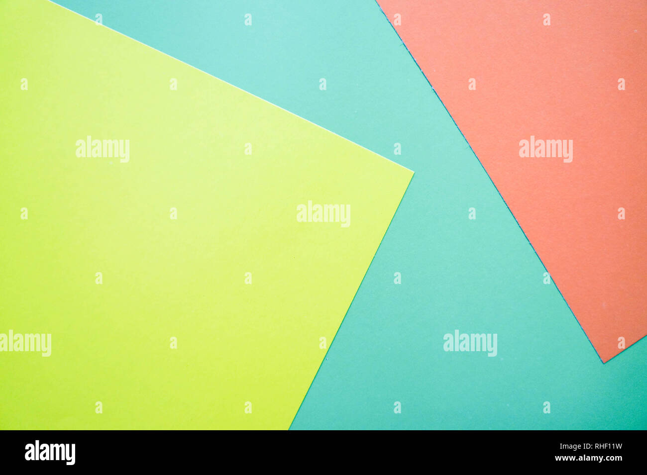 Abstract flat lay background with color paper sheets. Yellow, pink and ...