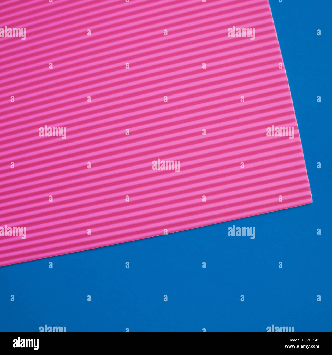 Abstract flat lay background with color crepe paper sheets. Pink and ...