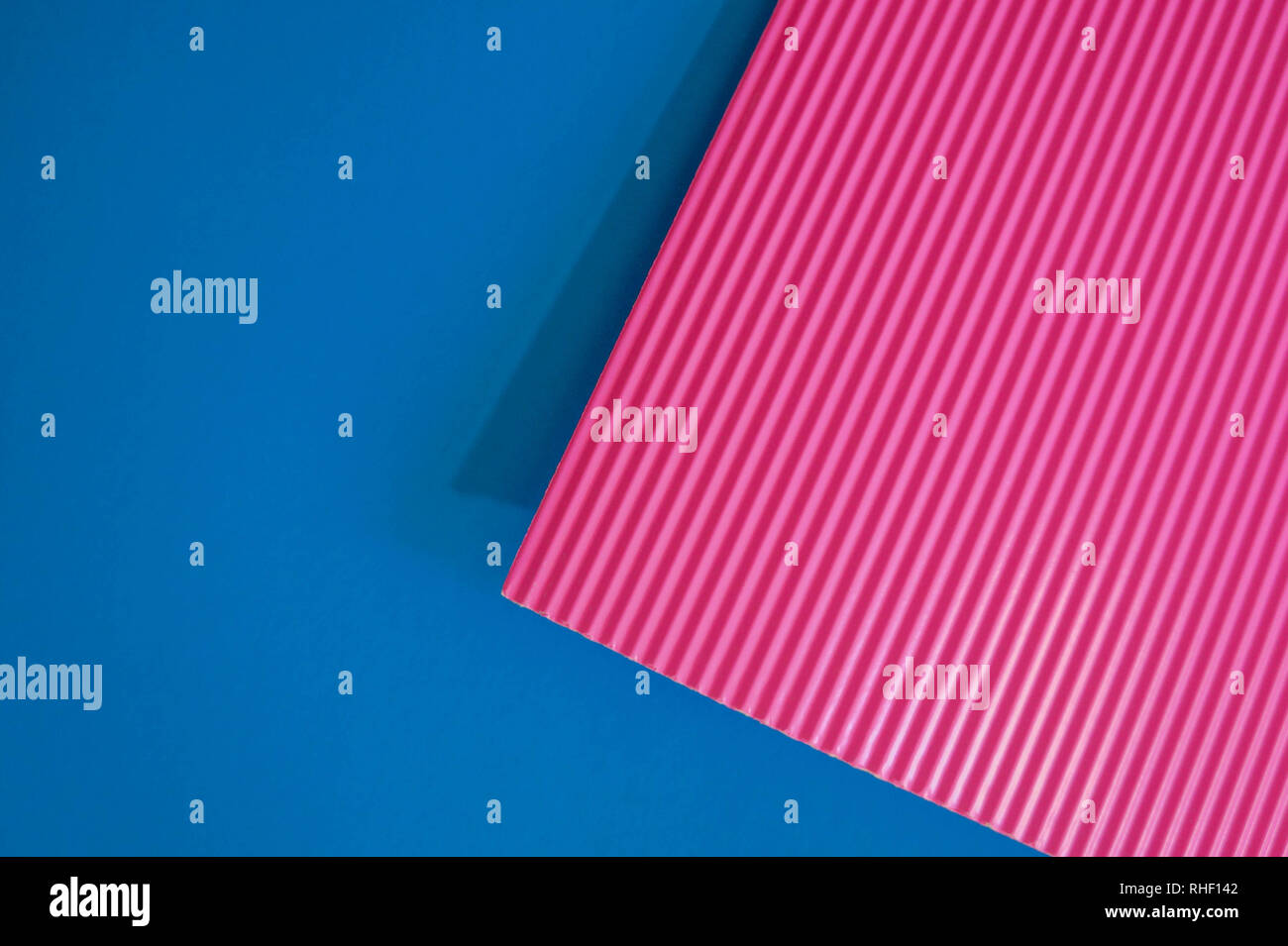 Abstract flat lay background with color crepe paper sheets. Pink and ...