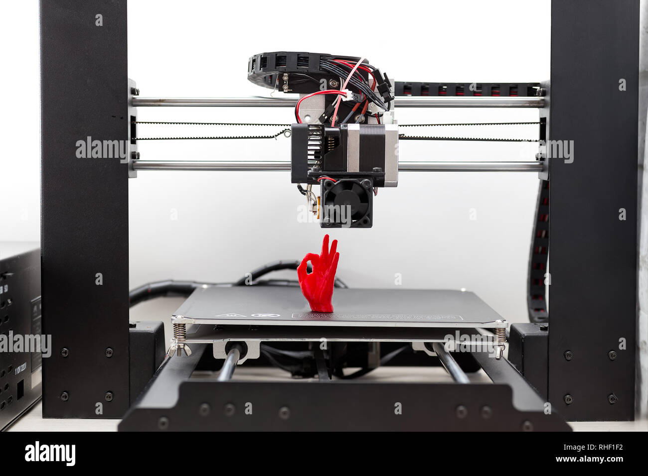 3d Printer and it is a model of red plastic, hand Stock Photo - Alamy