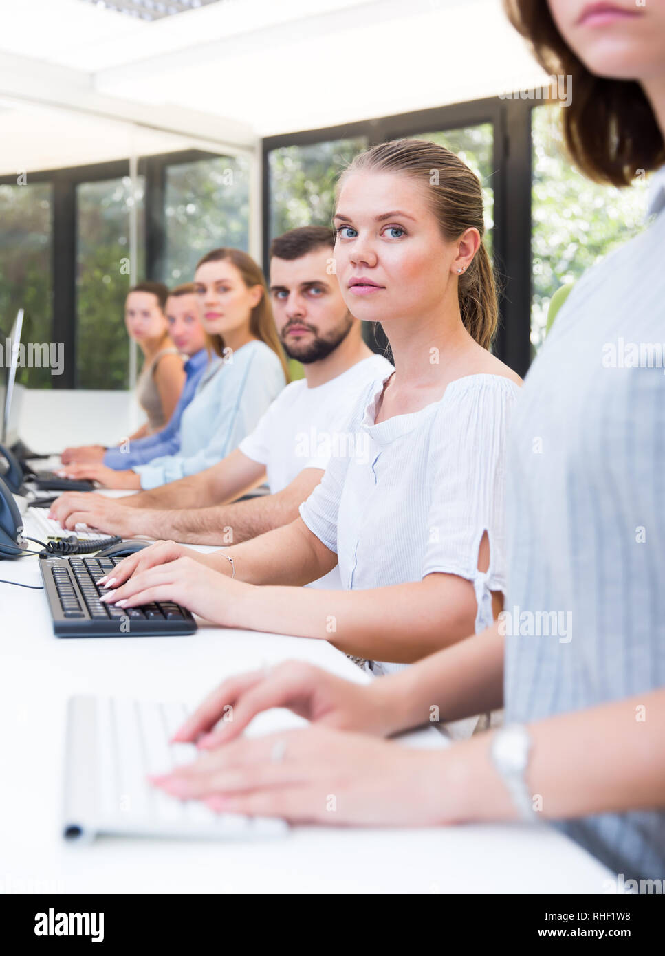 Happy employees open plan office hi-res stock photography and images ...