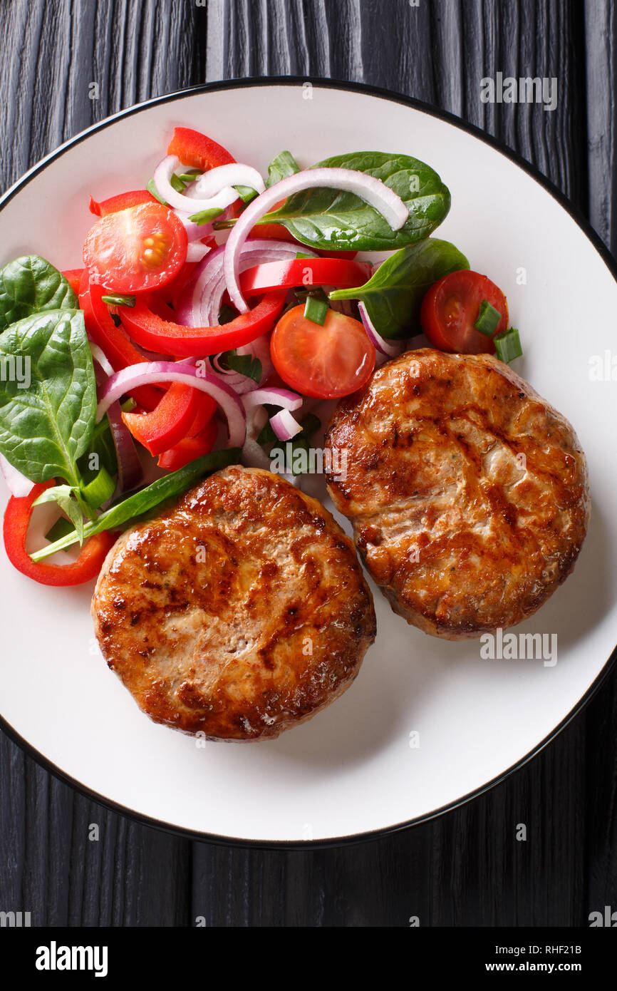 Natural French fried meat balls crepinette and fresh vegetable salad ...