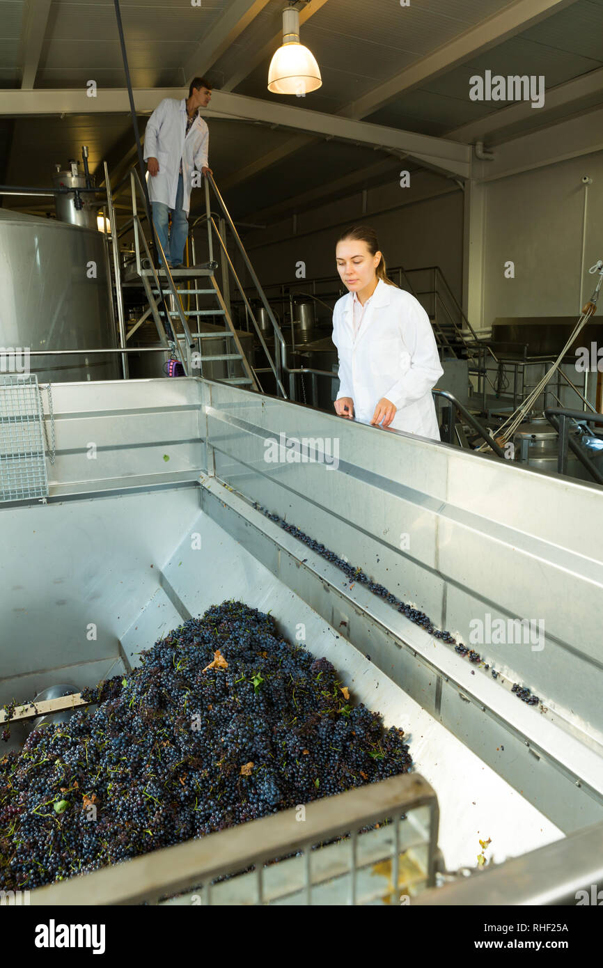 Woman pressing quality control hi-res stock photography and images - Alamy