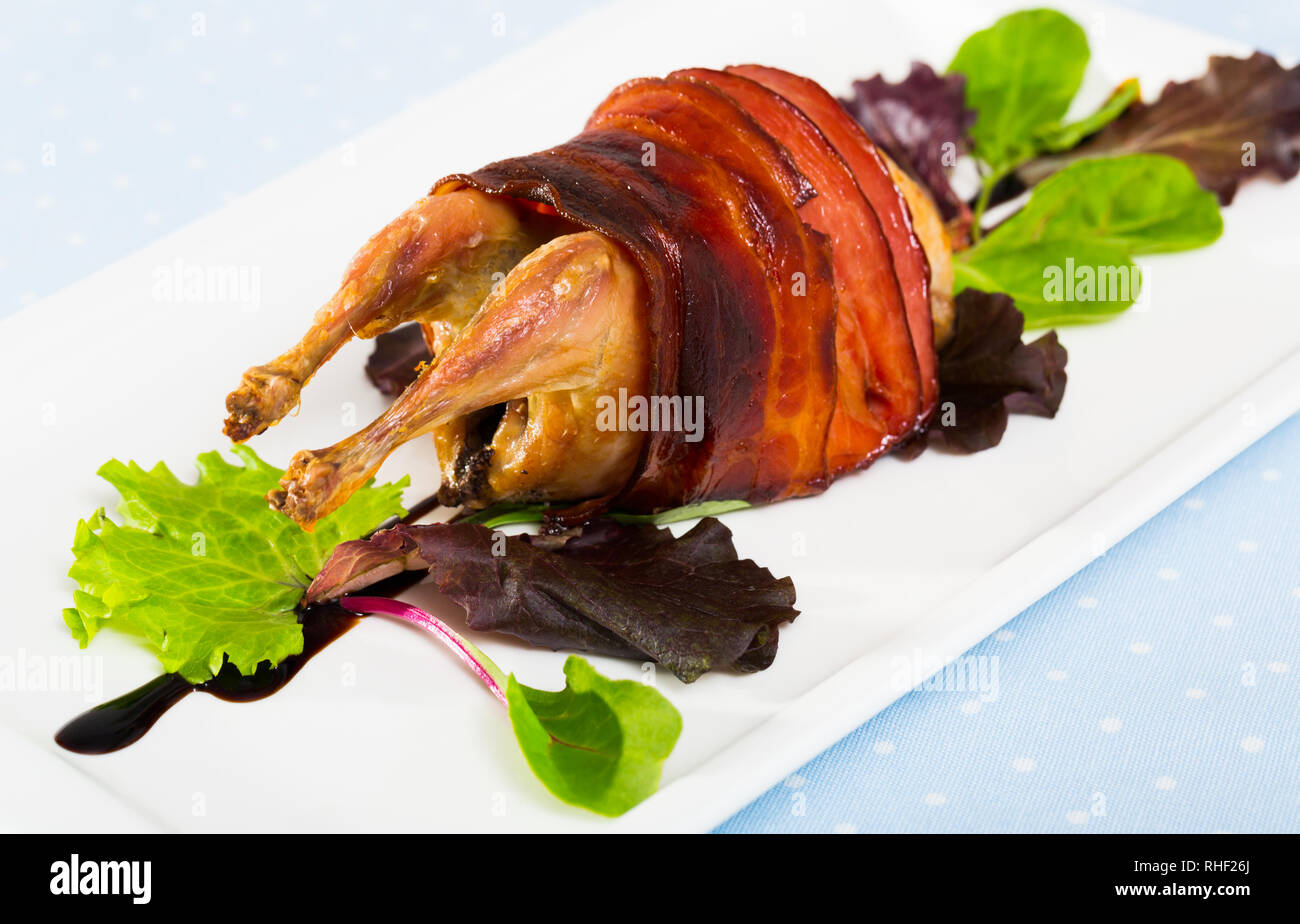 Photography of plate with baked in bacon quail with balsamic sauce in ...