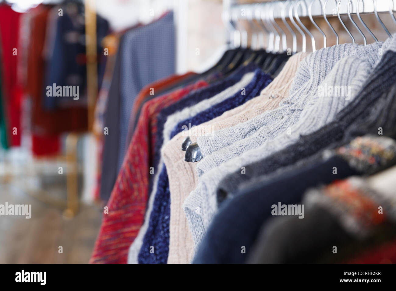 Colorful clothes hanging on hangers in the clothing store Stock Photo ...