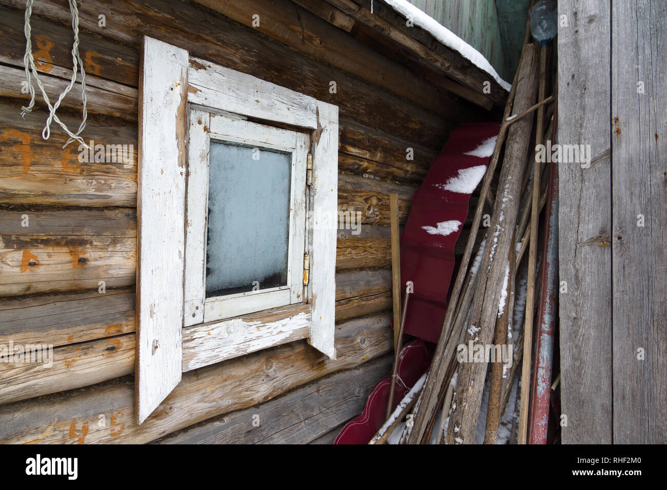 small frozen window in a small country house Stock Photo - Alamy