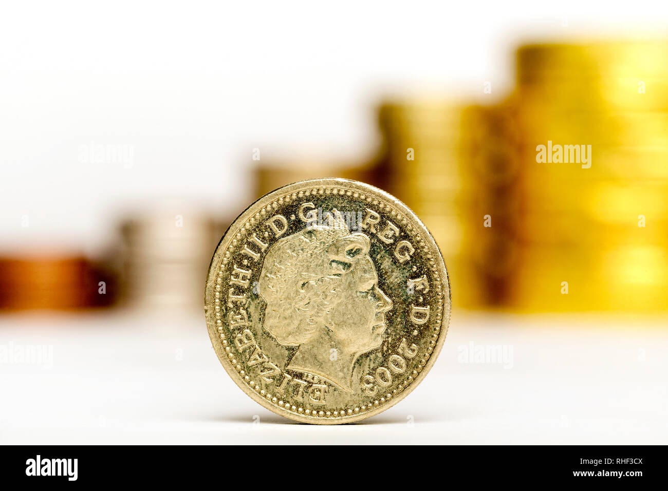 Close up of One British Pound with blurred money on the white ...