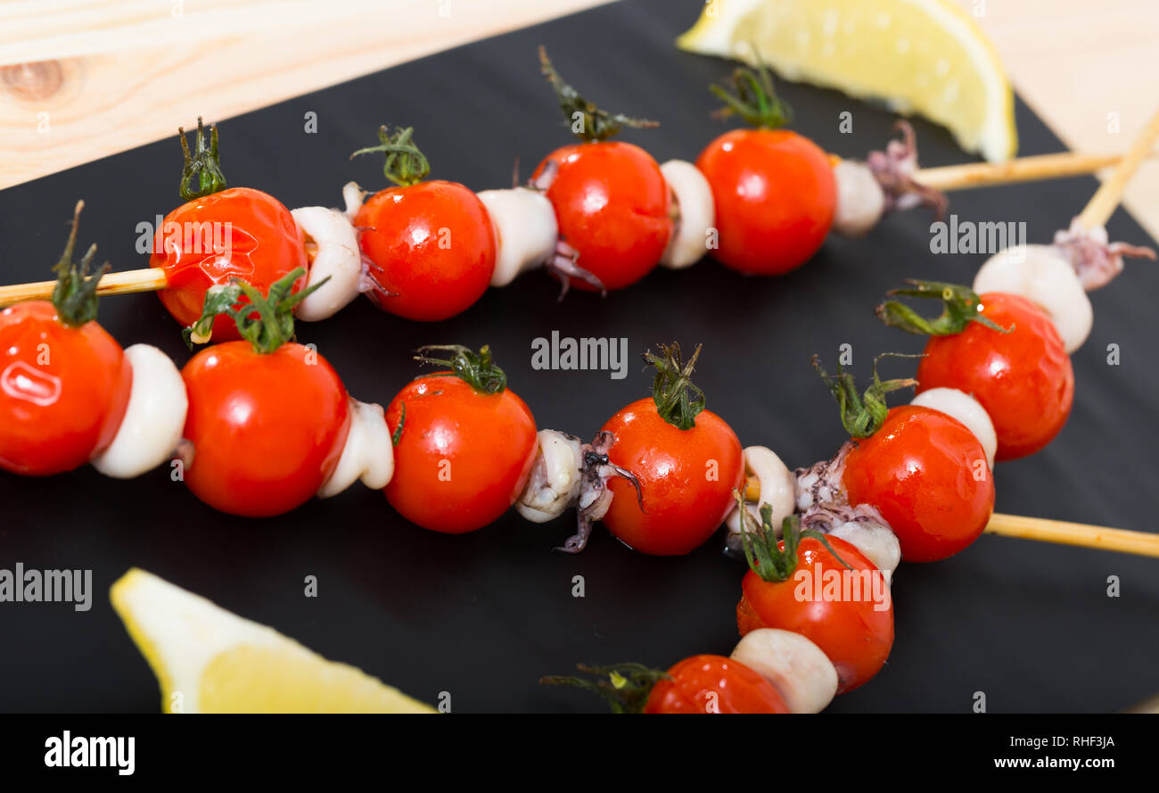 Mini calamari with cherry tomatoes grilled with olive oil and balsamic ...