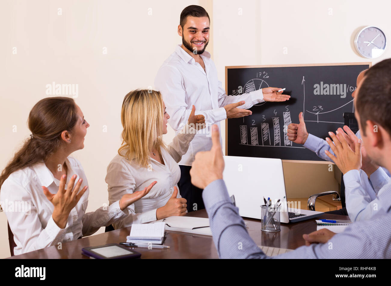 View at working meeting spanish people with diagram at background Stock ...