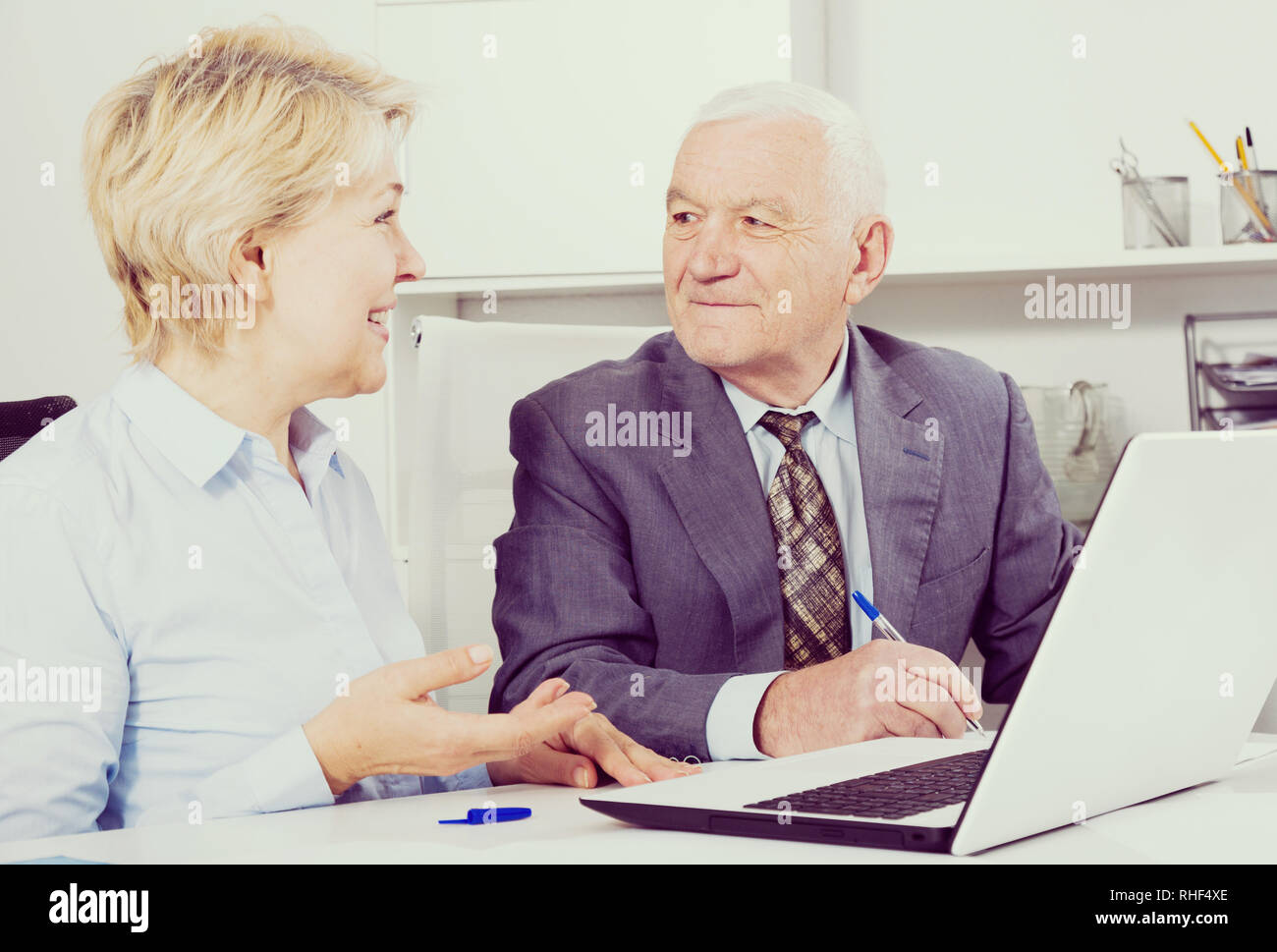 People working productively on business project together in office ...