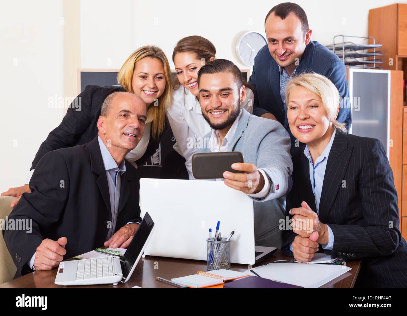 Successful positive business people having a break together in the ...