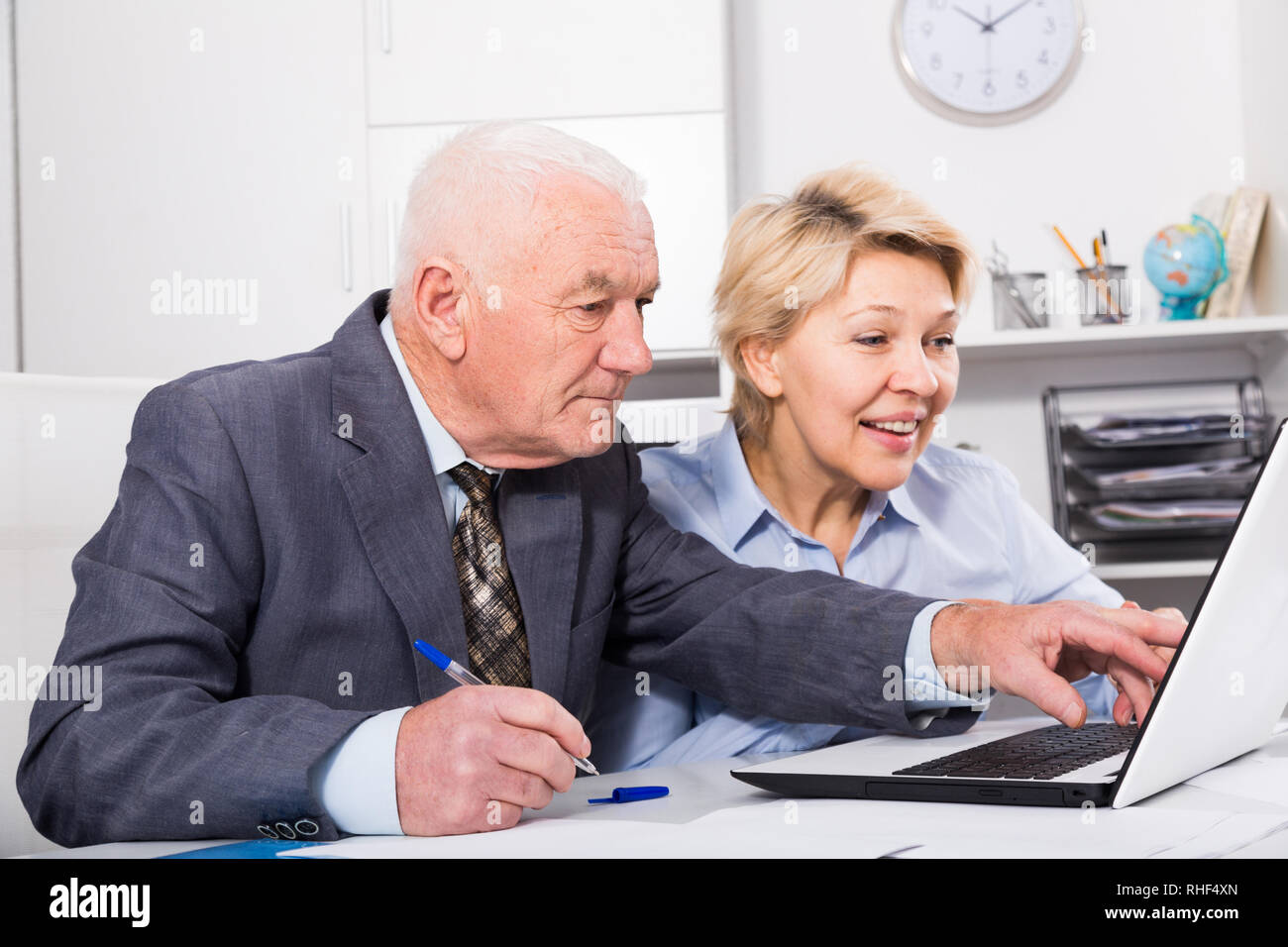 Coworkers working effectively on business project together in office ...