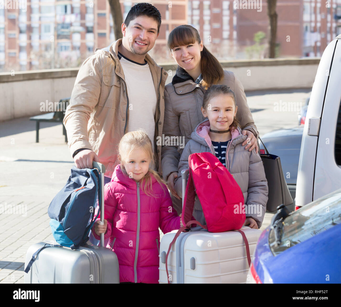 Family portrait baggage parking hi-res stock photography and images - Alamy