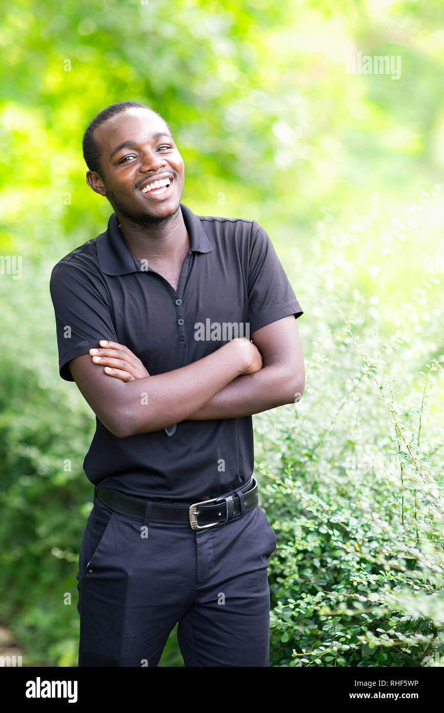 Freedom african man smiles happily in green nature Stock Photo - Alamy