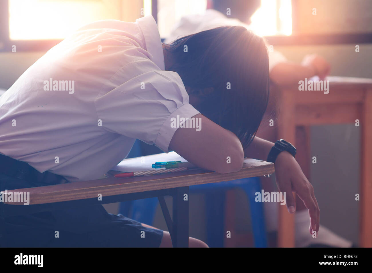Asian woman student sleep on the table in classroom Stock Photo - Alamy