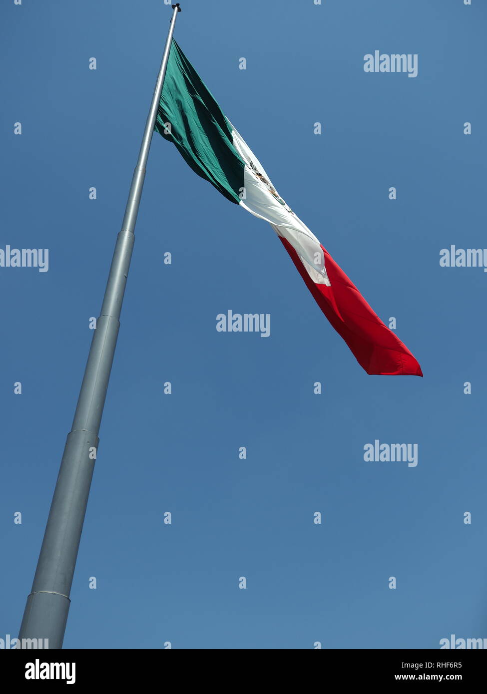 Beauty national maxican flag on beach at bay of Pacific Ocean in ...