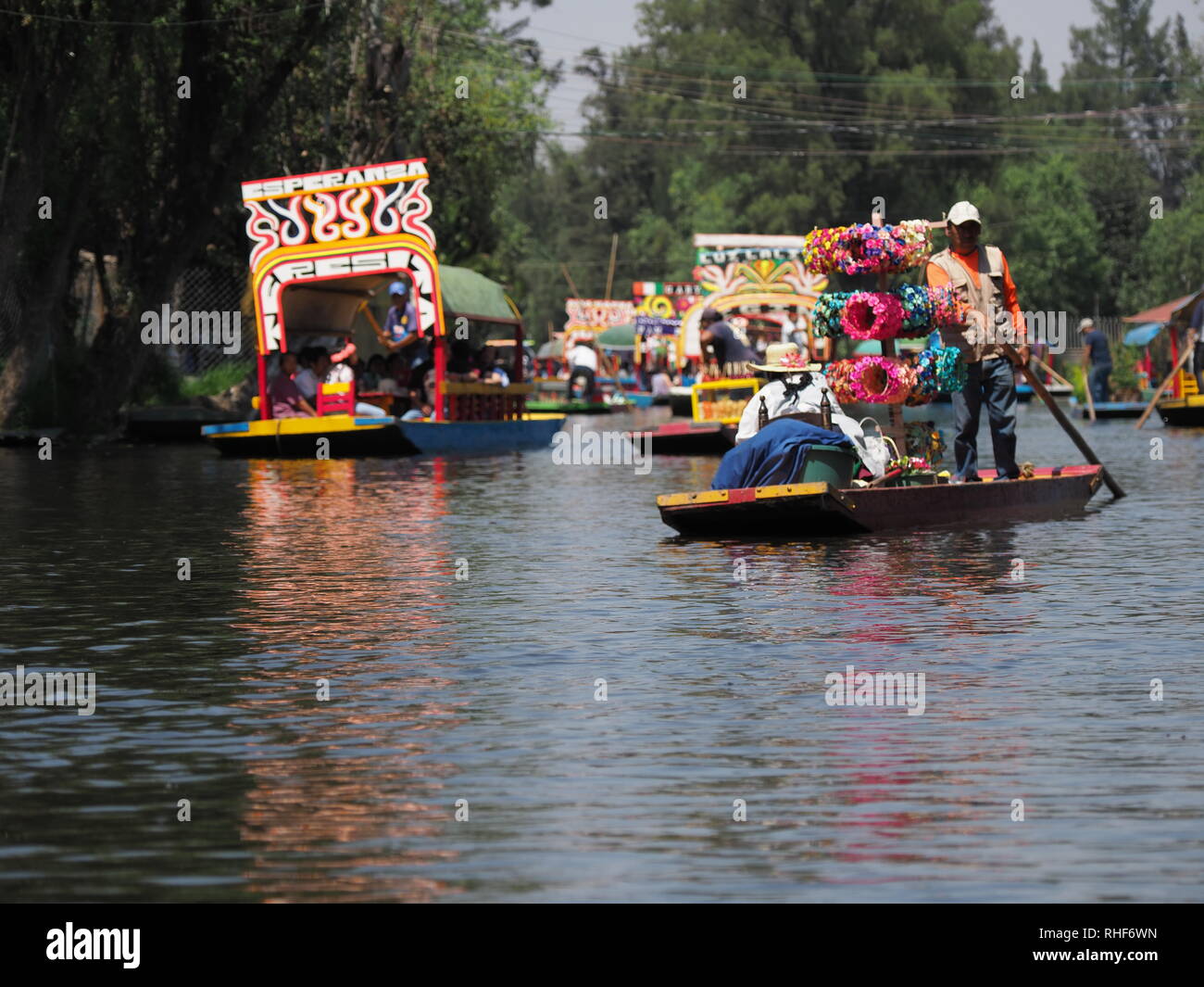 Colorful several mexican boats with tourists and gondoliers at ...