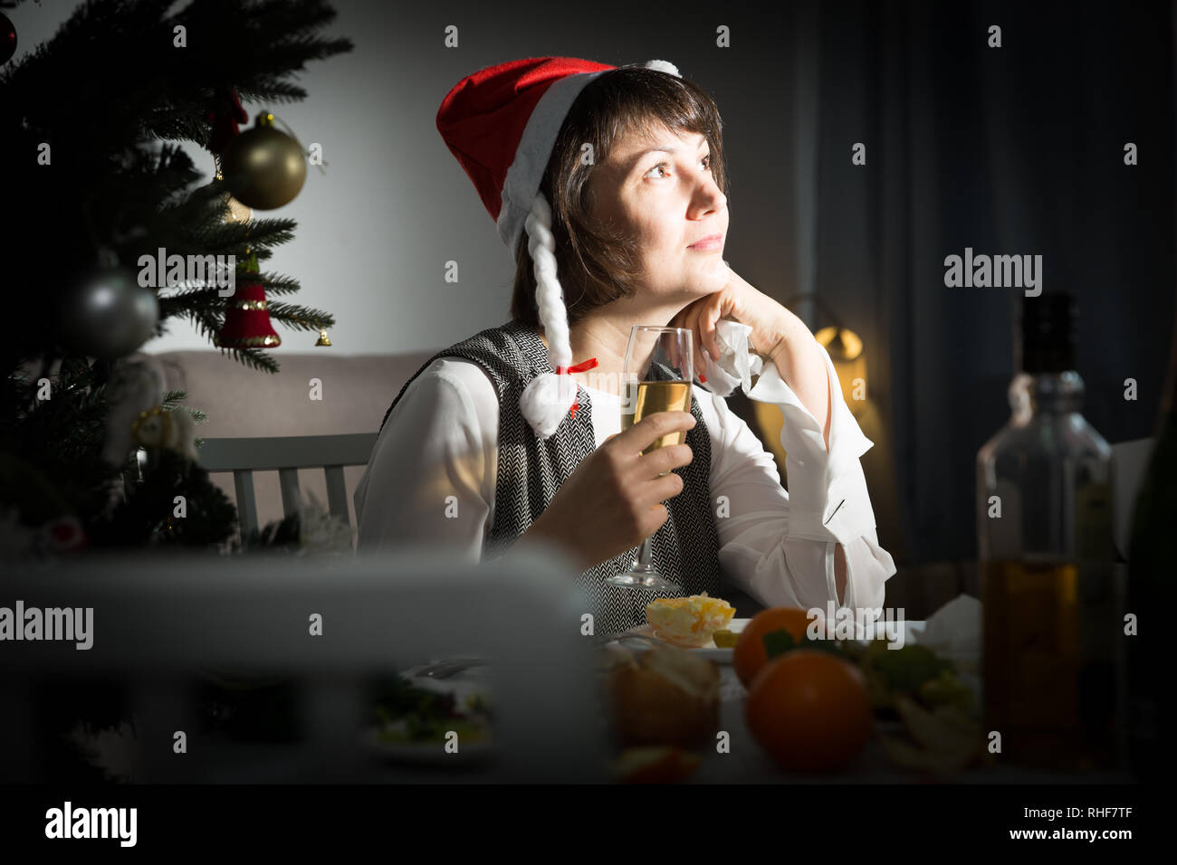 Sad girl celebrates New Year alone Stock Photo - Alamy