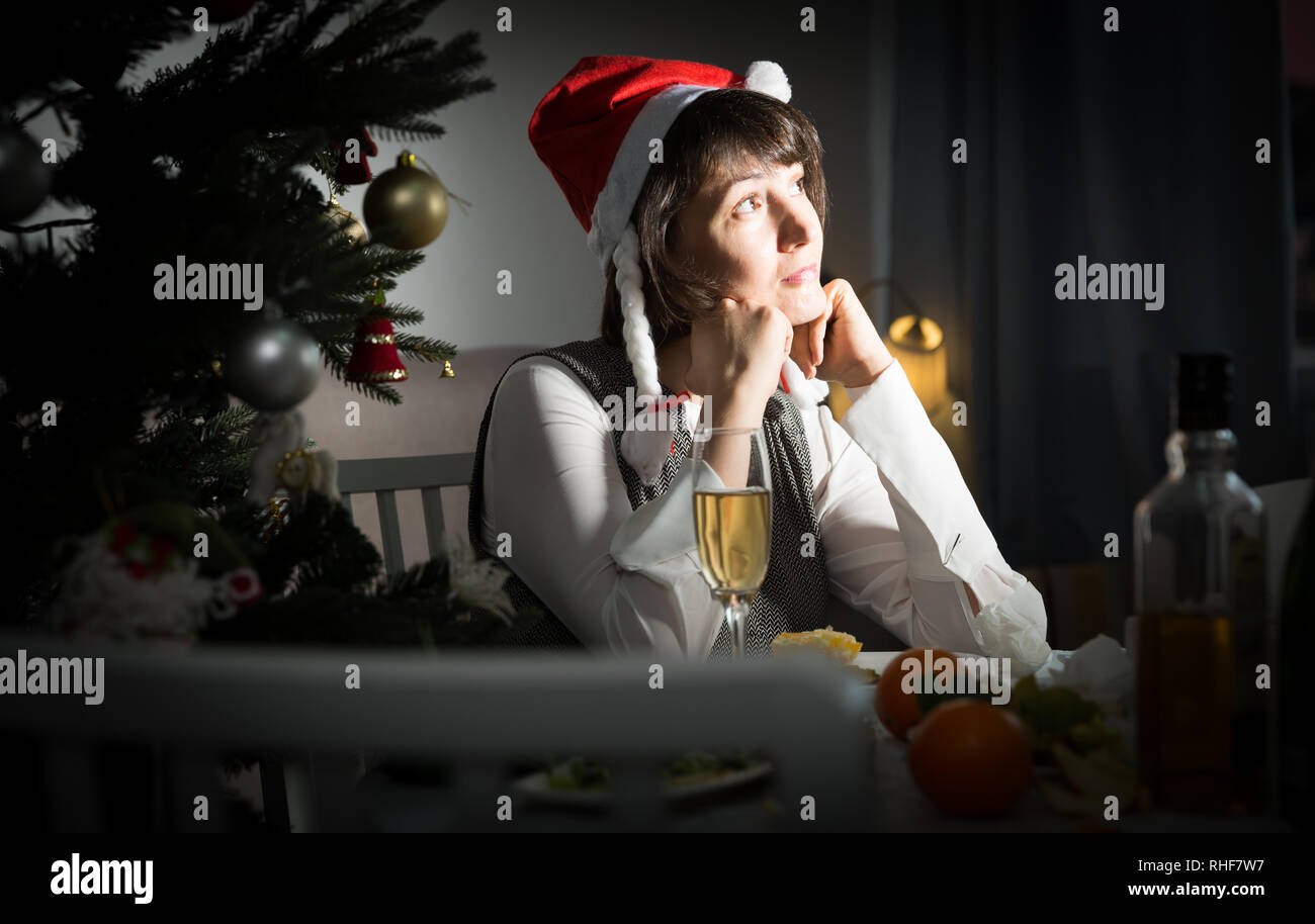 Sad girl celebrates New Year alone Stock Photo - Alamy