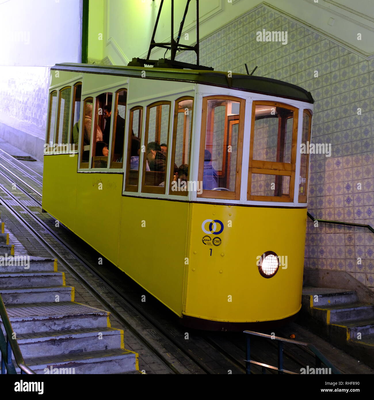 Traditional Bright Yellow Lisbon Tram steep slope descent Stock Photo ...