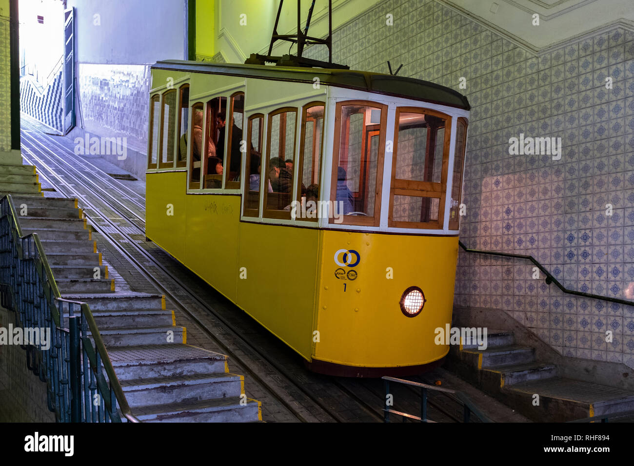 Traditional Bright Yellow Lisbon Tram steep slope descent Stock Photo ...