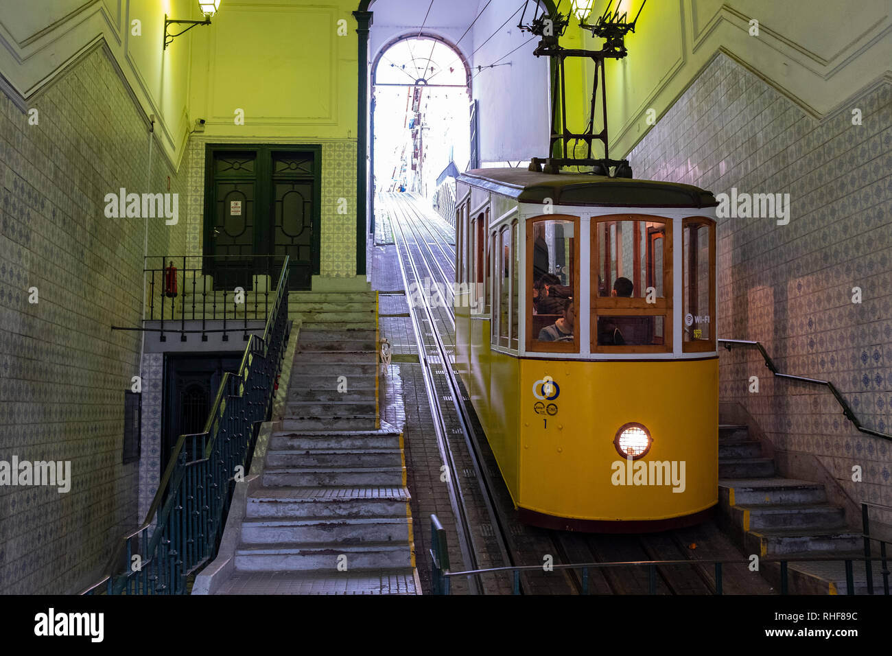 Traditional Bright Yellow Lisbon Tram steep slope descent Stock Photo ...