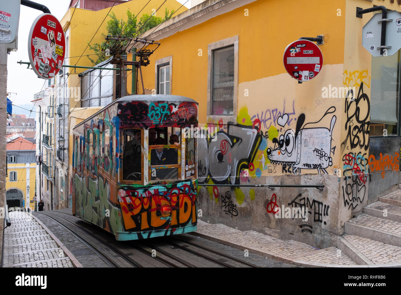 Traditional Brightly Coloured Lisbon Tram steep slope descent Stock ...