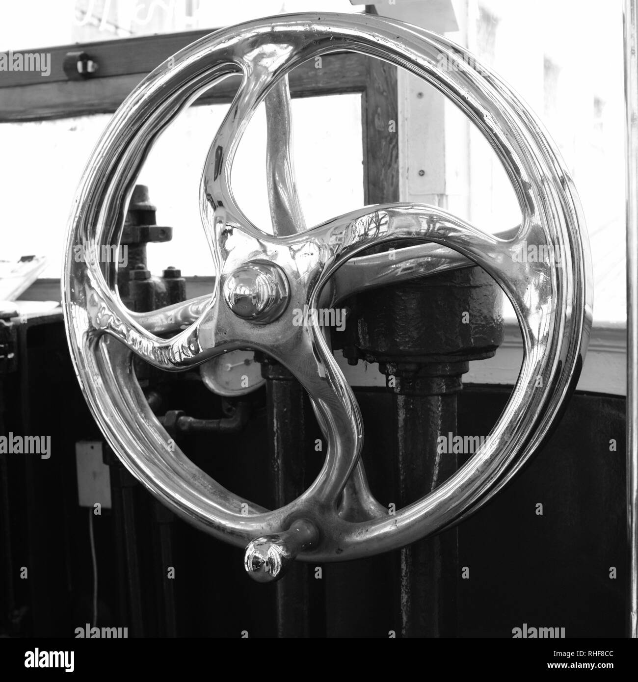 Highly polished chrome tram wheel in cabin of traditional Lisbon Tram ...