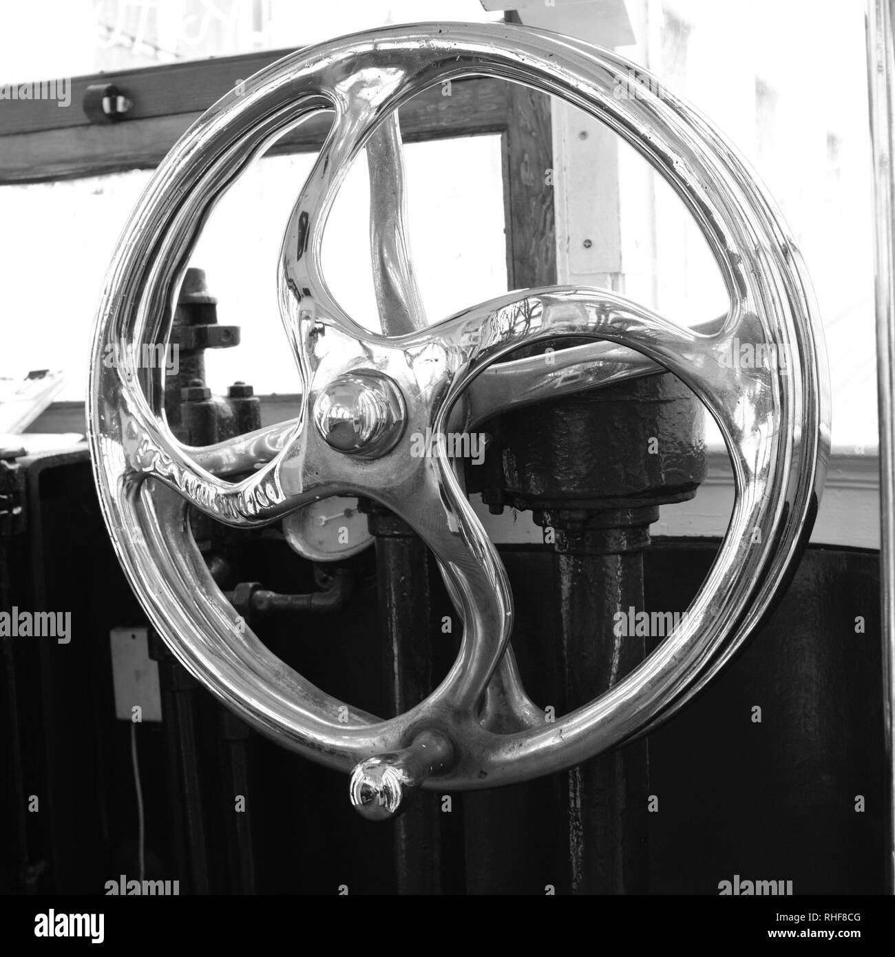 Highly polished chrome tram wheel in cabin of traditional Lisbon Tram ...