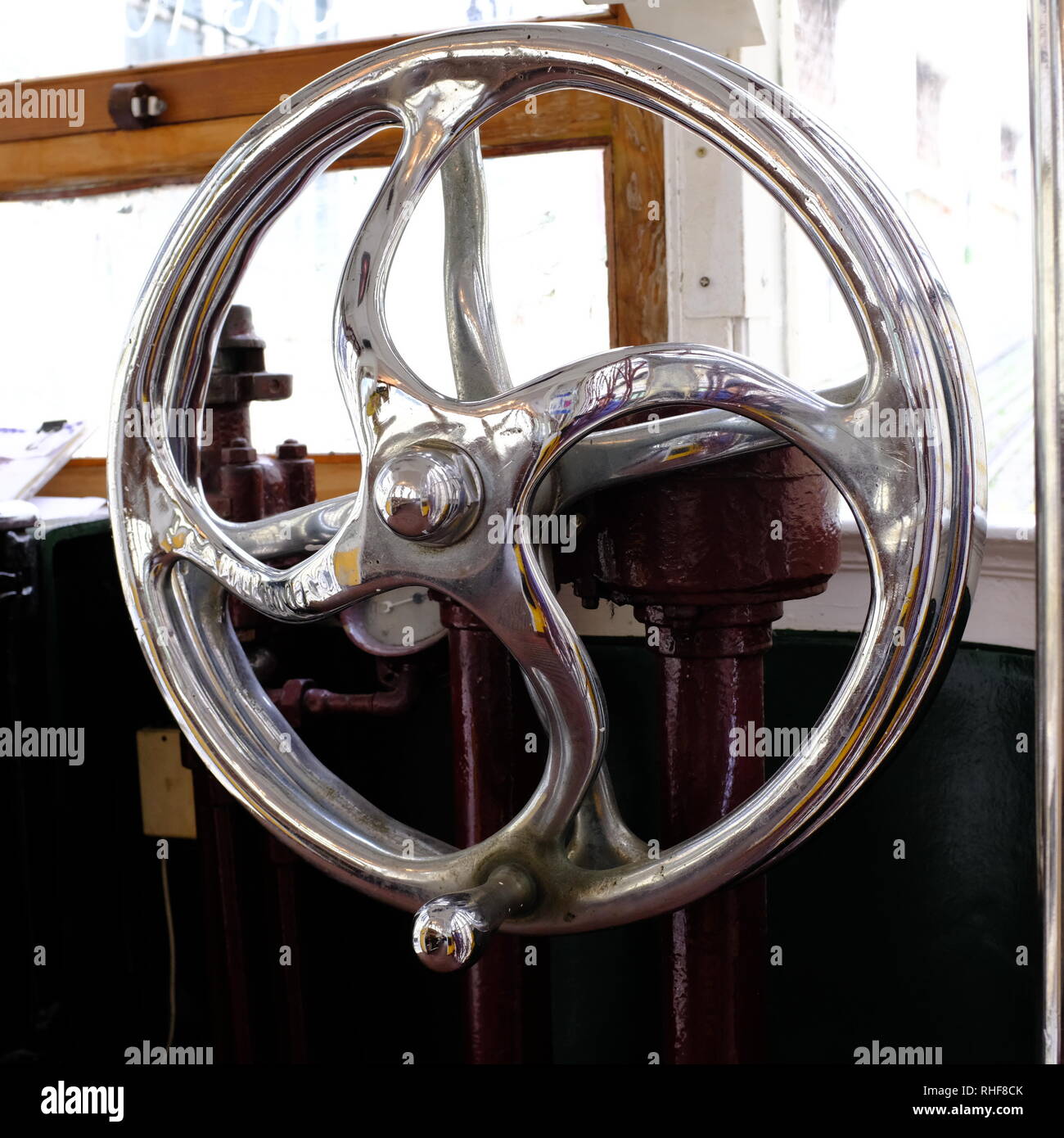 Highly polished chrome tram wheel in cabin of traditional Lisbon Tram ...