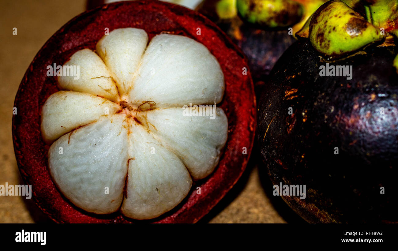 closeup of tropical fruit mangosteen with white flesh Stock Photo - Alamy
