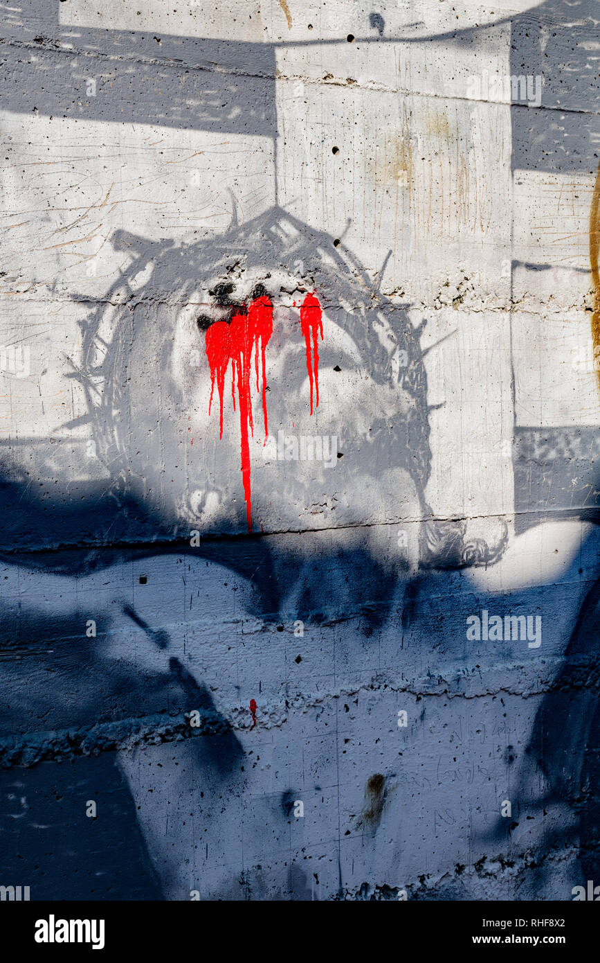 Jesus with his eyes painted over by the Nazi Swastika, then repainted ...