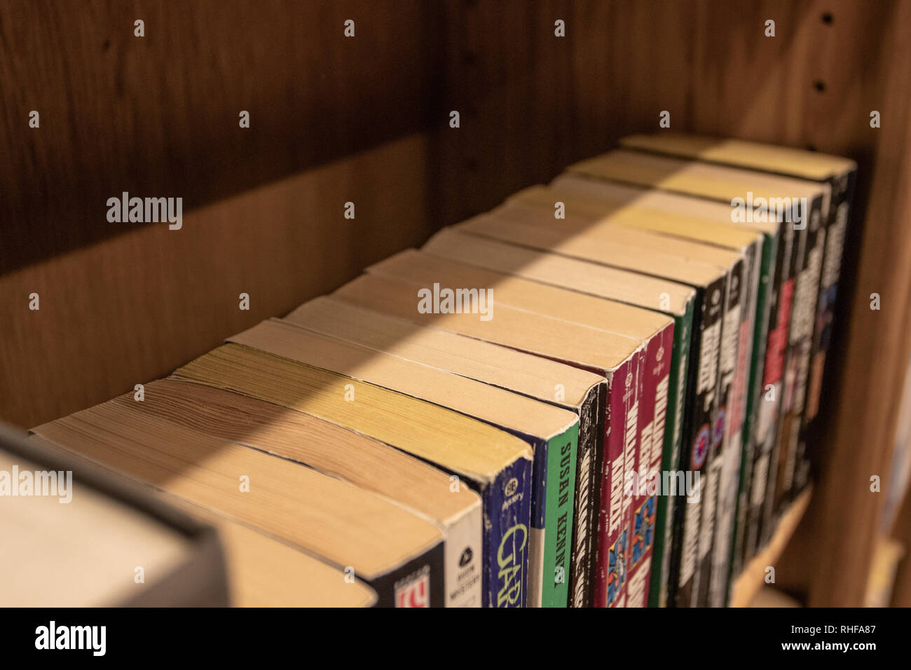 Books on a shelf Stock Photo - Alamy