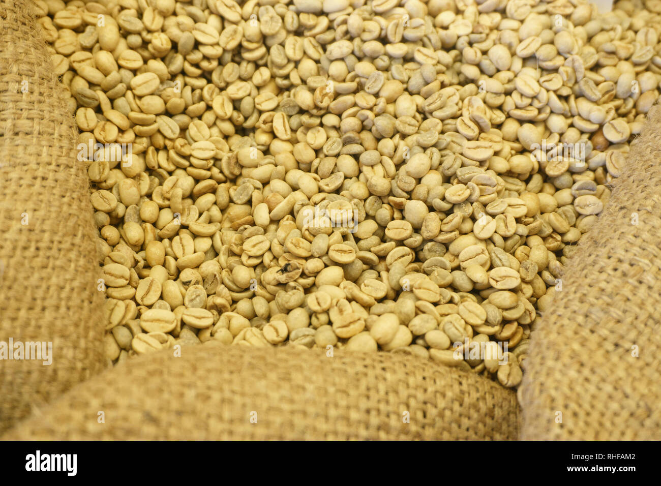 Raw coffee bean for background Stock Photo - Alamy