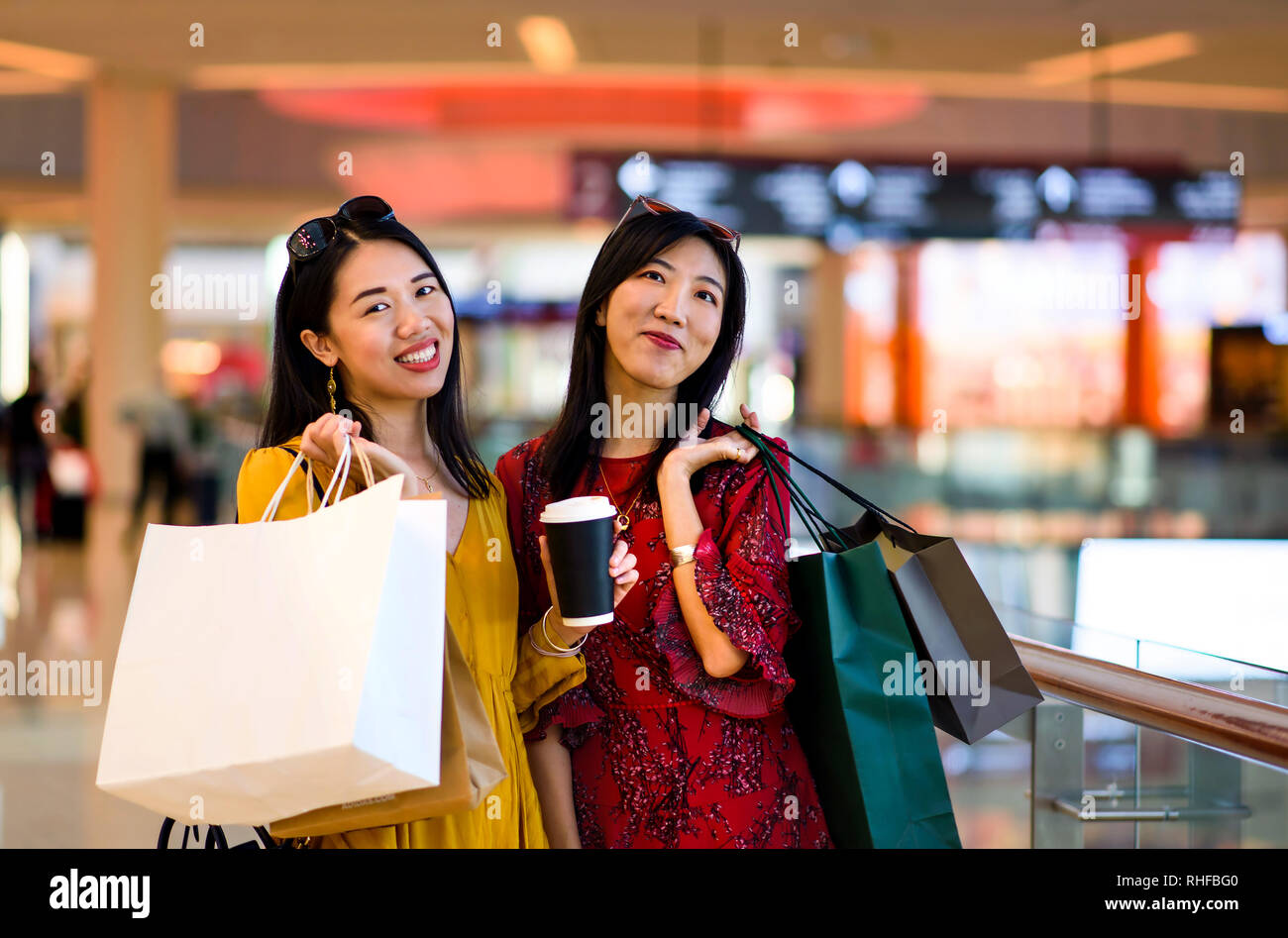 Asian girls doing shopping in the mall Stock Photo - Alamy