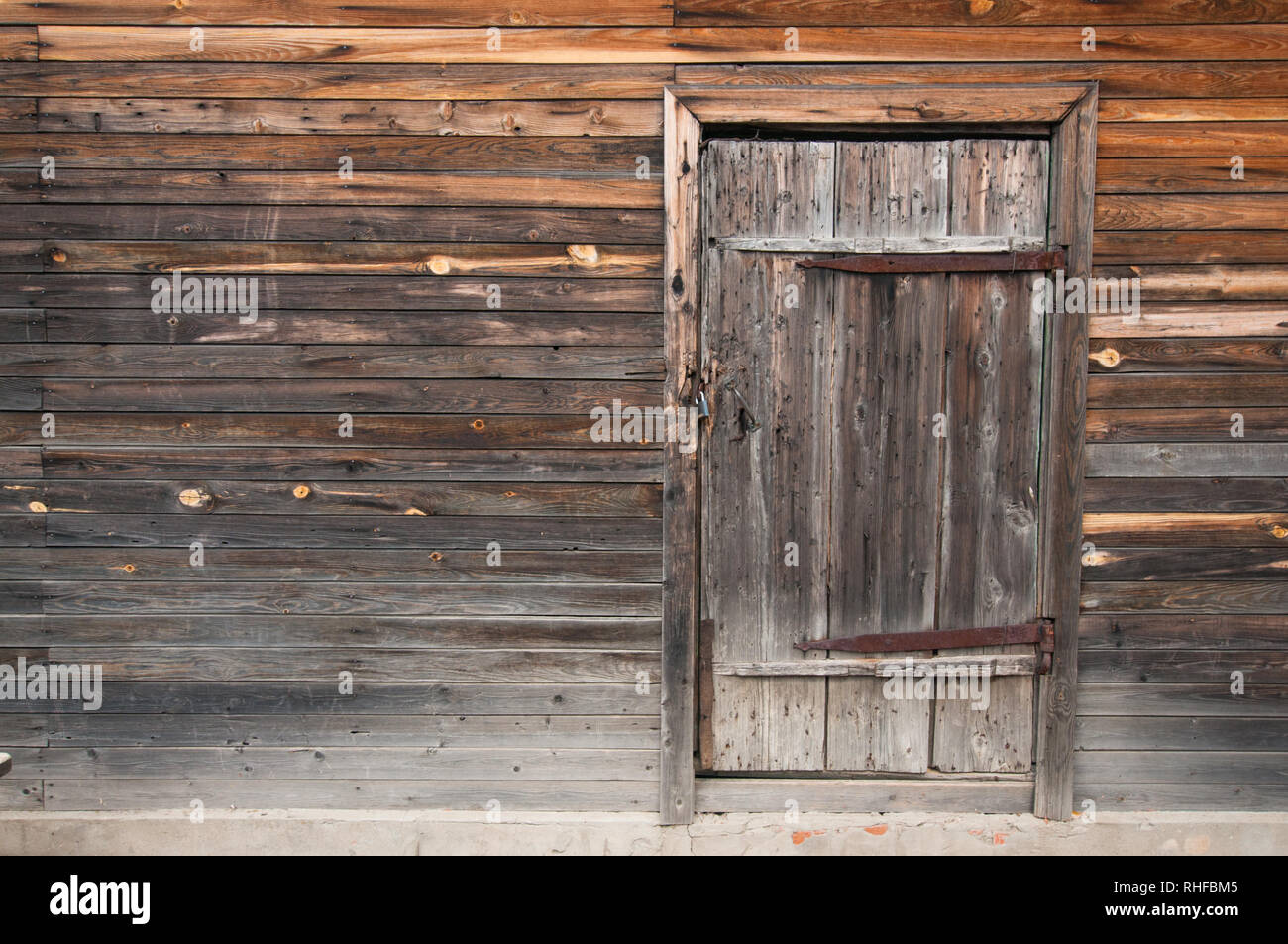 Front view: old rustic wooden wall and door Stock Photo - Alamy