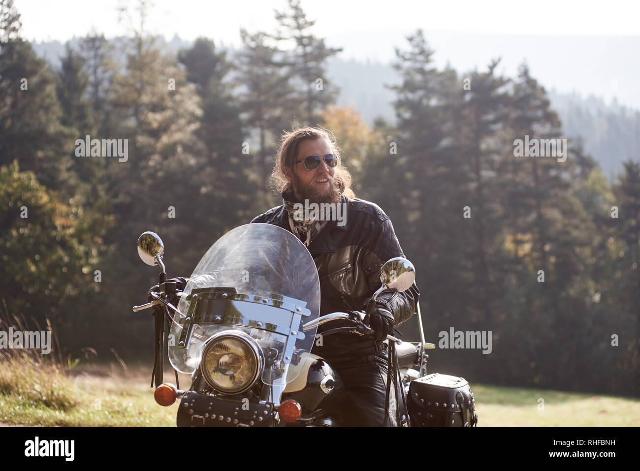 Man profile long hair motorcycle hi-res stock photography and images ...