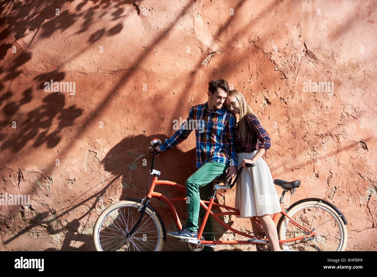 Man and woman riding tandem hi-res stock photography and images - Alamy
