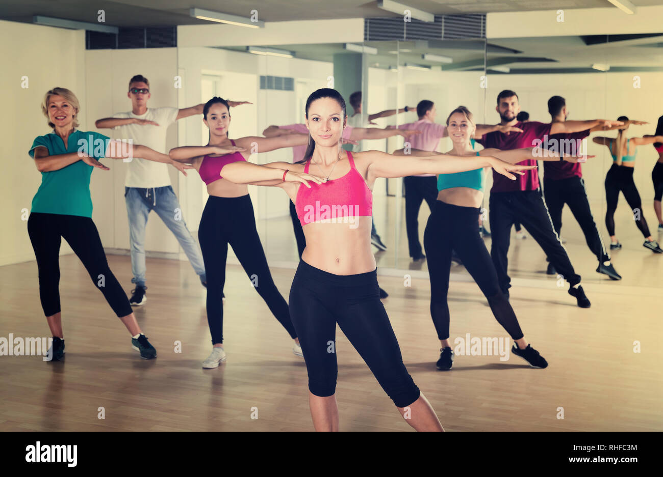 Group of active smiling people dancing together in dance studio Stock ...
