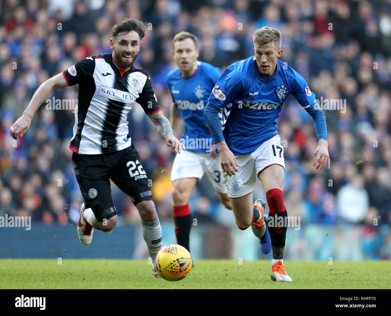 Rangers' Ross McCrorie challenges St Mirren's Greg Tansey (left) during ...