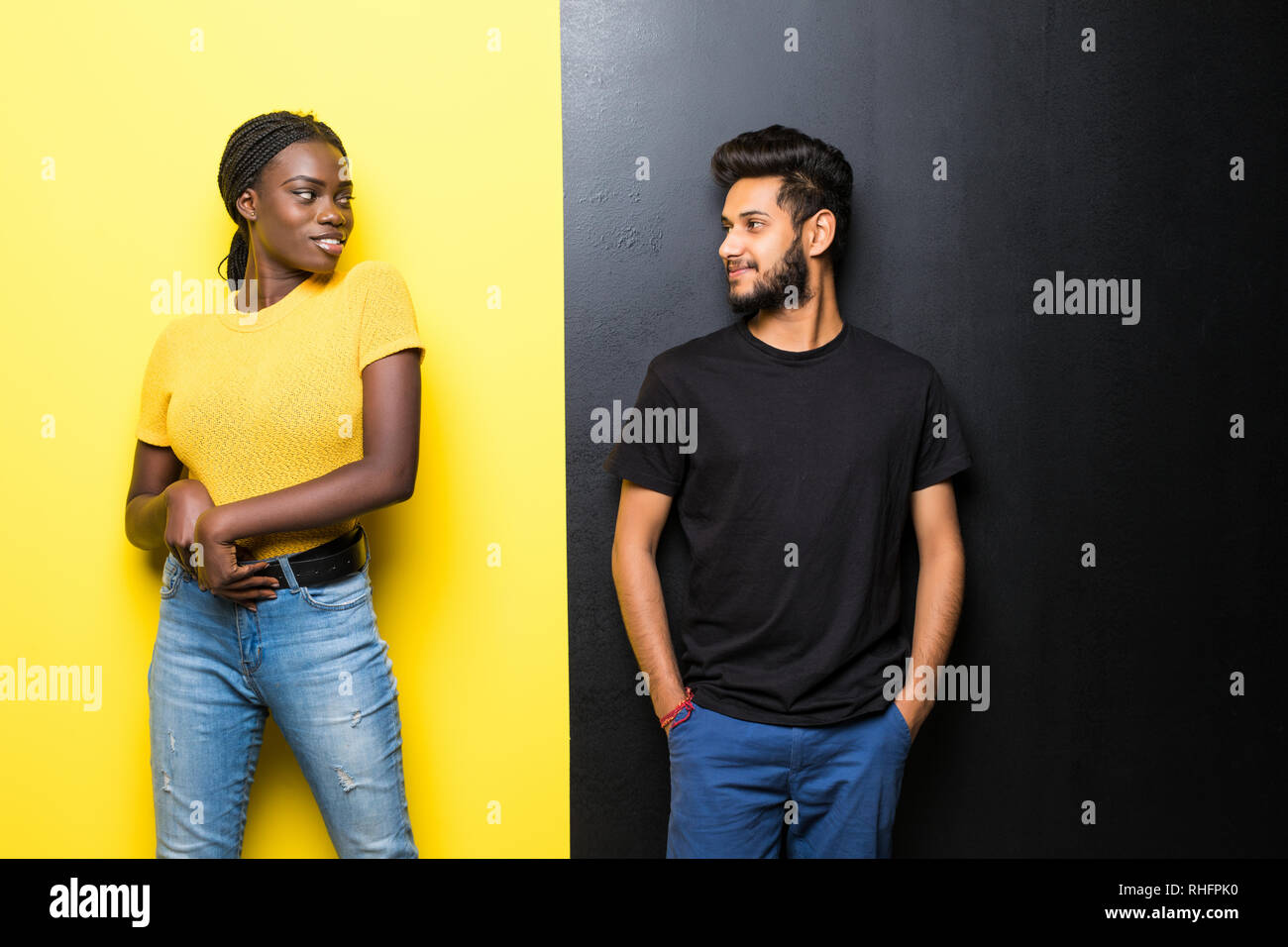 Young mixed race couple indian man and african woman standing isolated ...