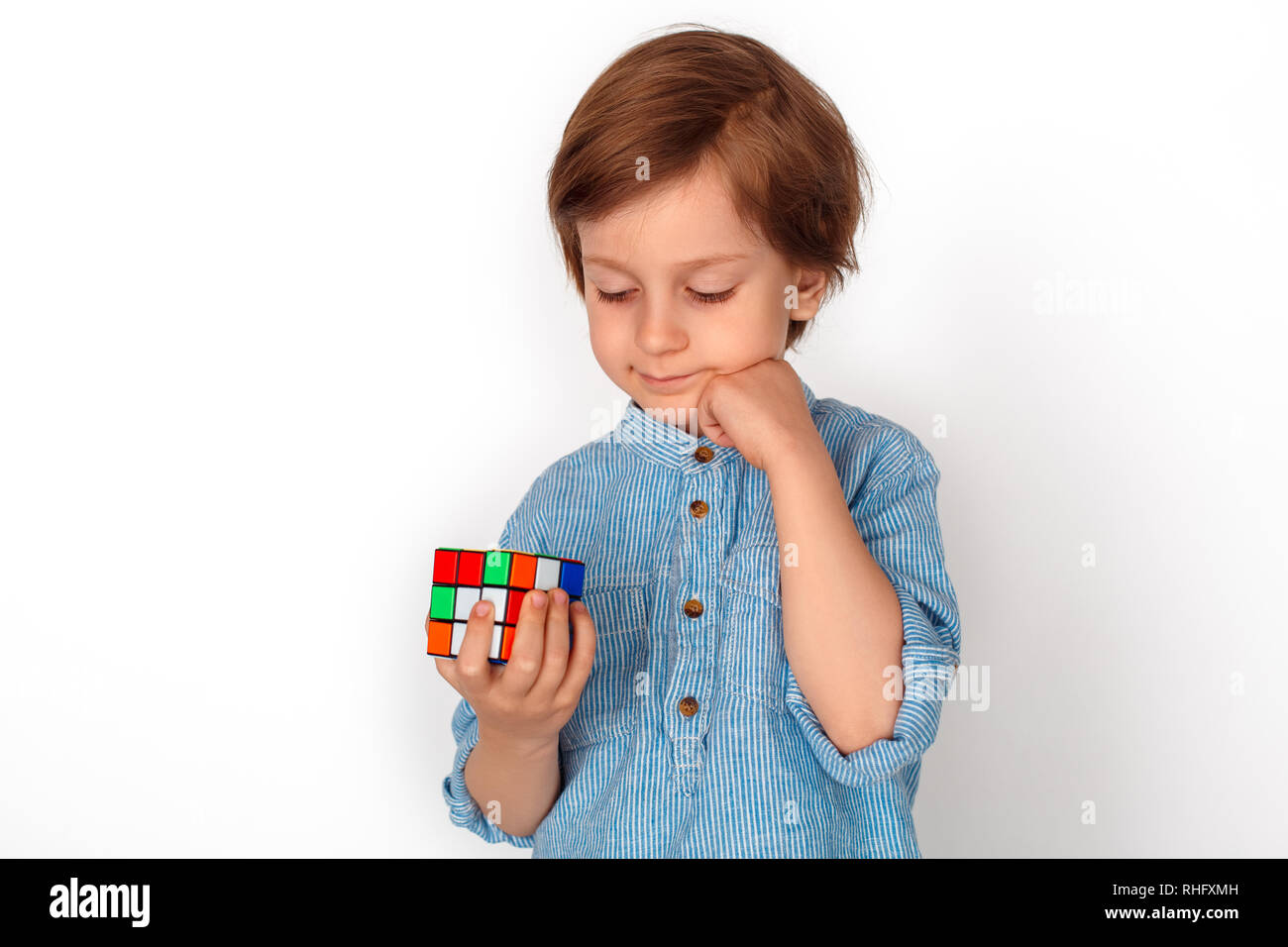 Child solving rubiks cube hi-res stock photography and images - Alamy