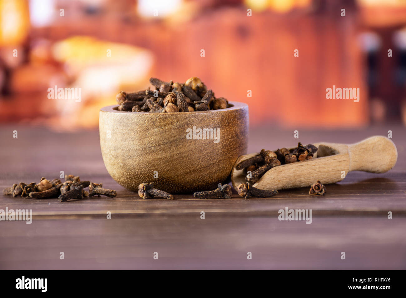Lot of whole small dried cloves spice scoop with wooden bowl with ...