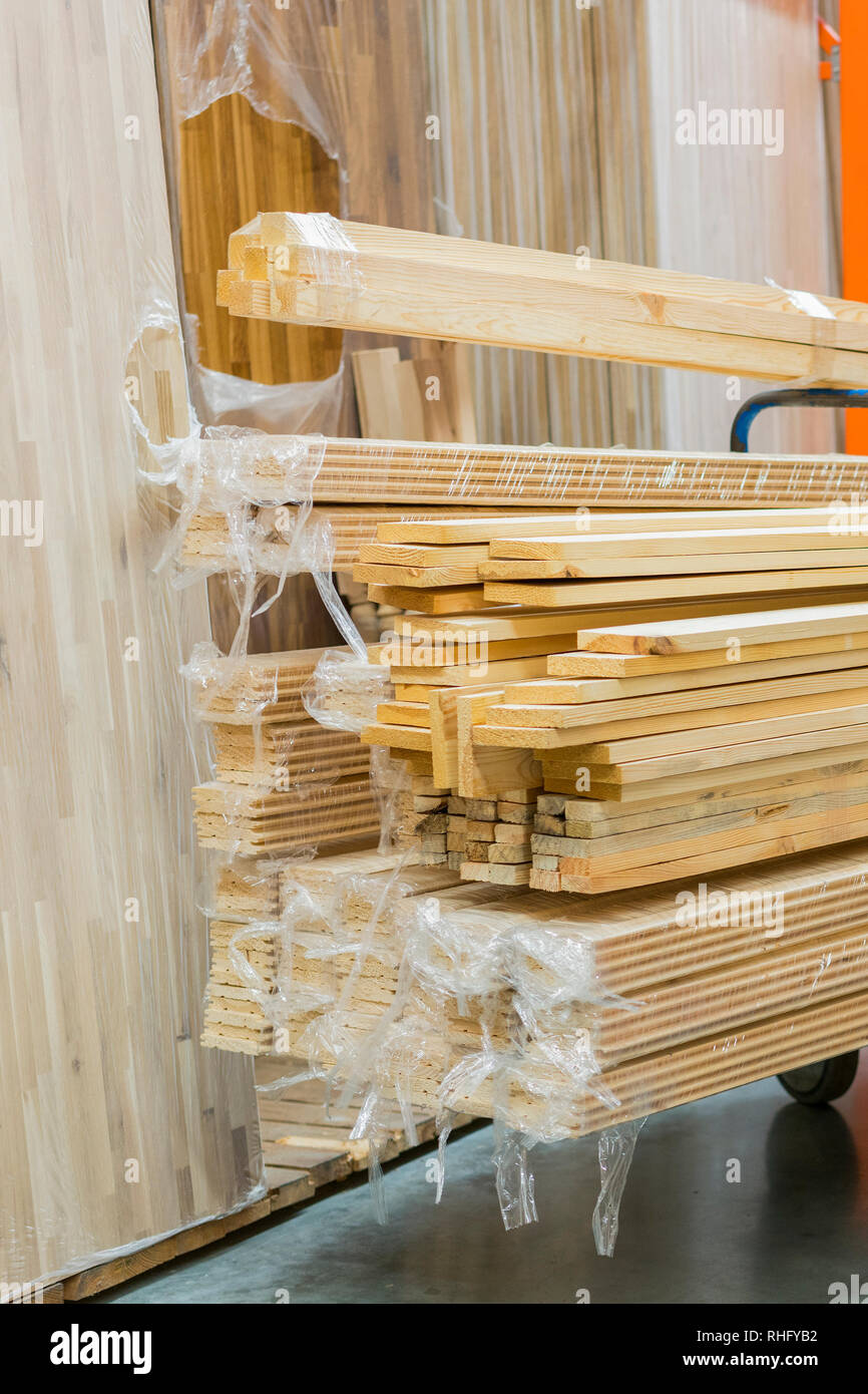 Wood stacked on shelving inside a lumber yard. Lumber Racks Stock Photo ...