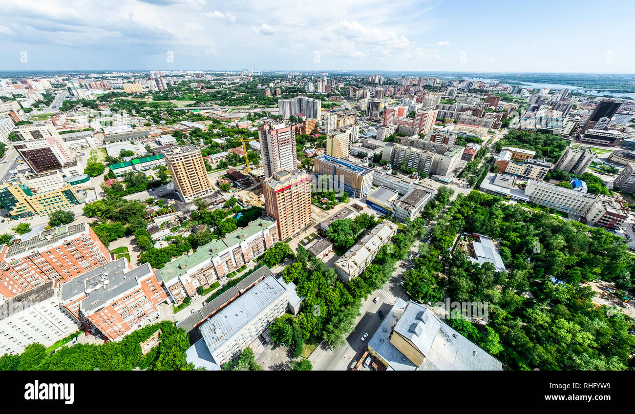 Aerial city view with crossroads and roads, houses, buildings, parks ...