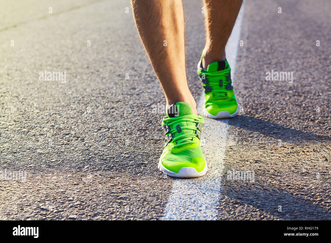 Runner man feet running on road closeup on shoe. Male fitness athlete ...