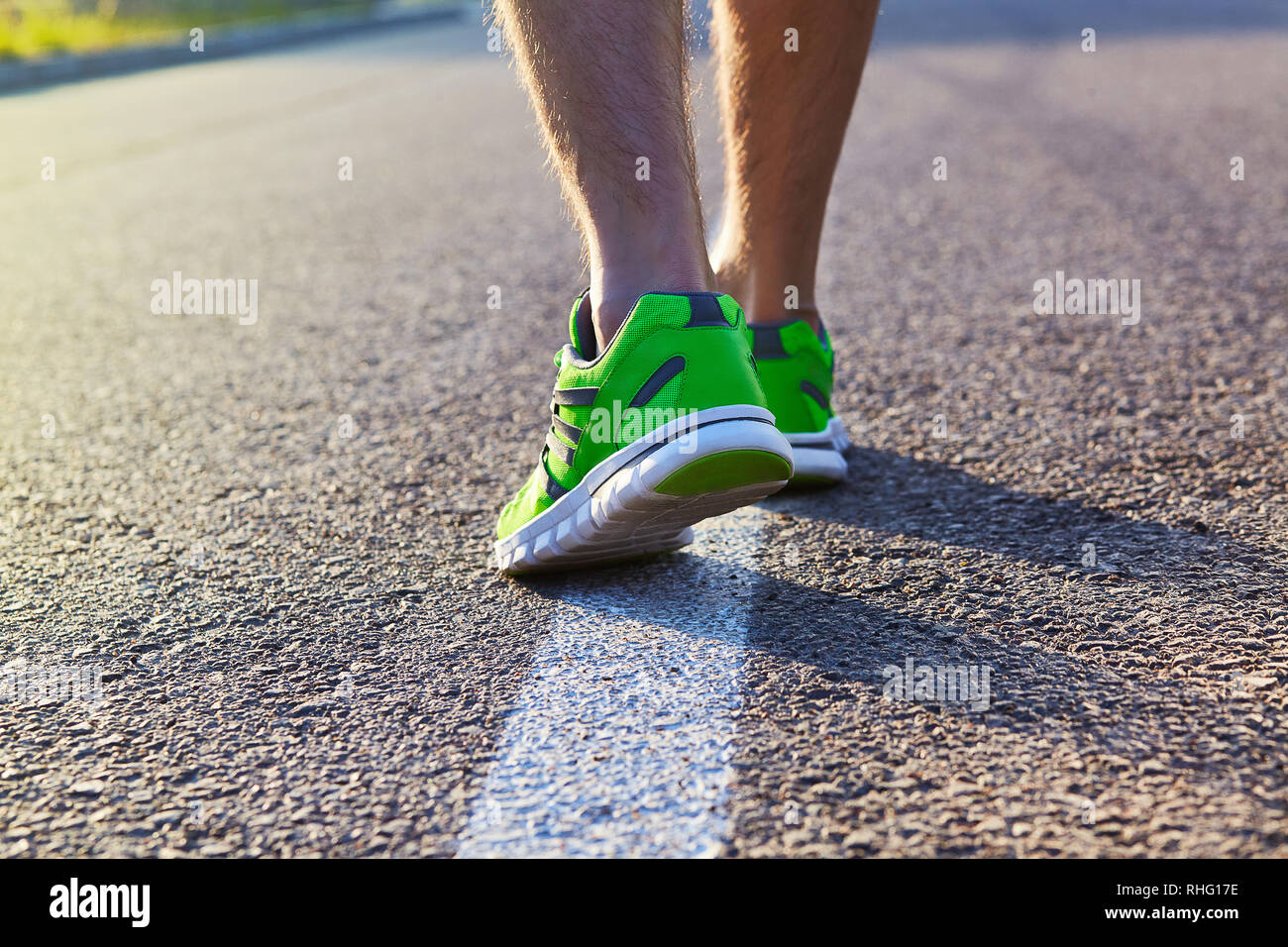 Runner man feet running on road closeup on shoe. Male fitness athlete ...