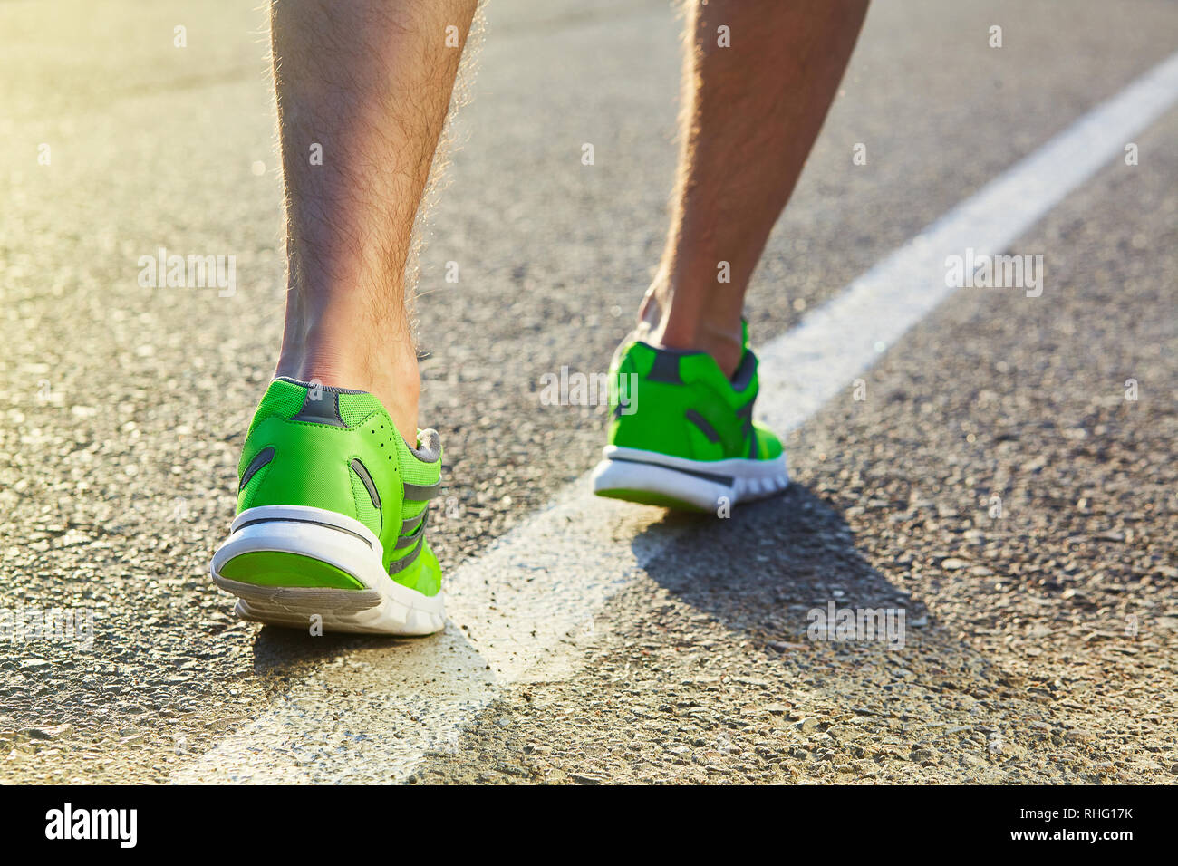Runner man feet running on road closeup on shoe. Male fitness athlete ...