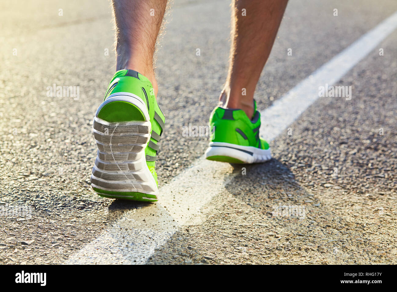 Runner man feet running on road closeup on shoe. Male fitness athlete ...